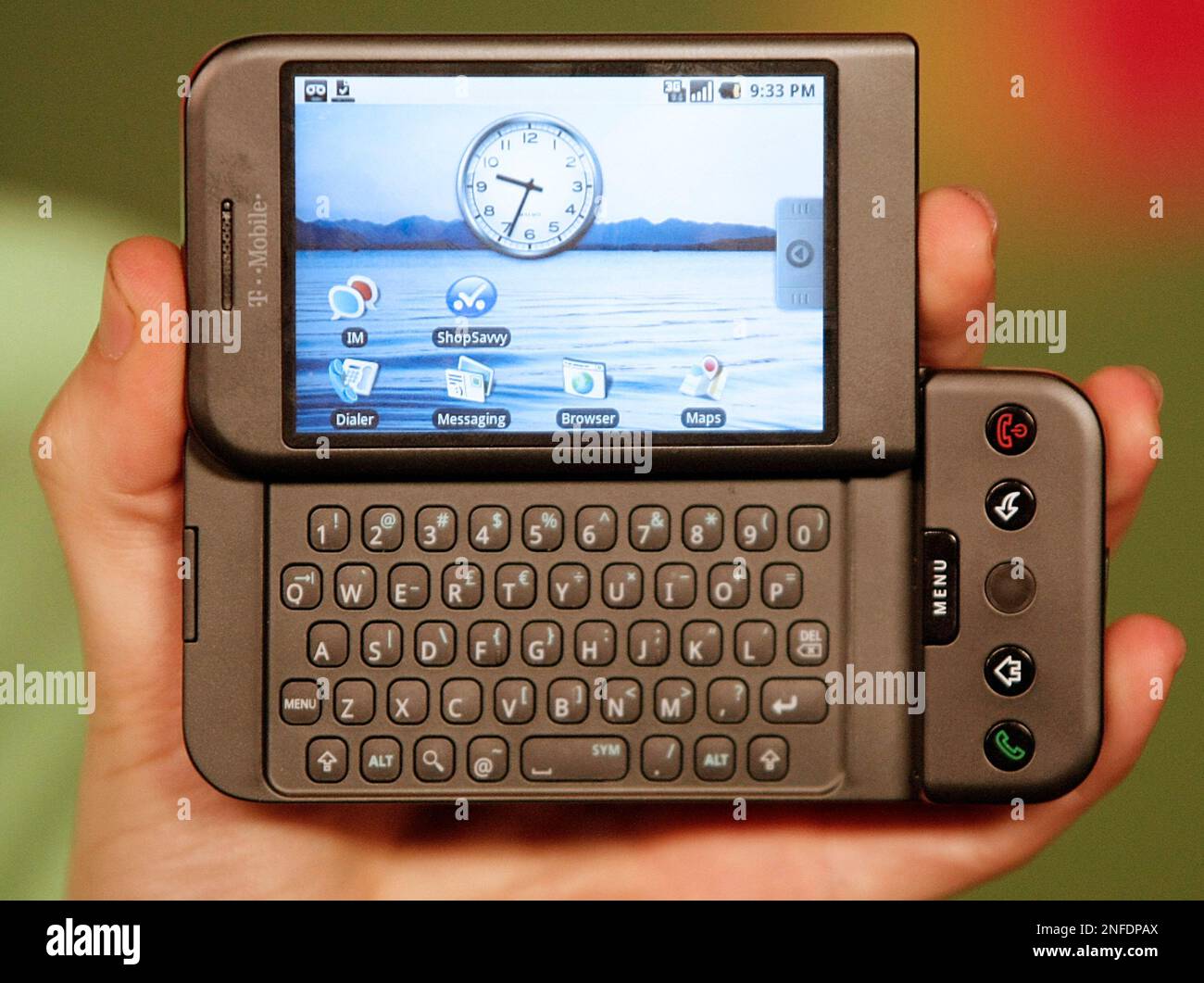 A model holds up the G1 phone at the T-Mobile G1 debut party in Los ...