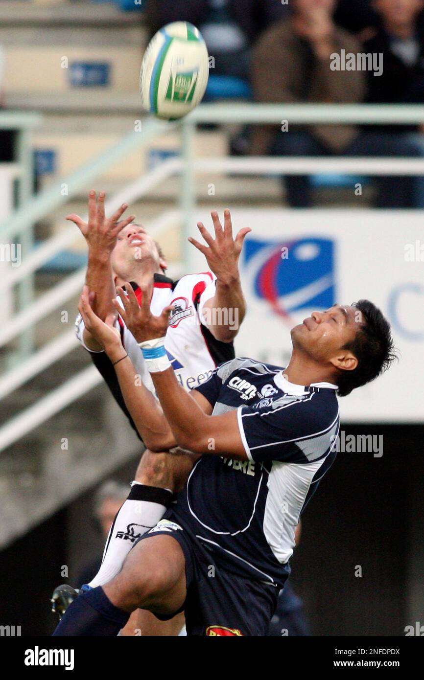 Steve Kefu of Castres, right, and Mike Blair jump for the ball during ...