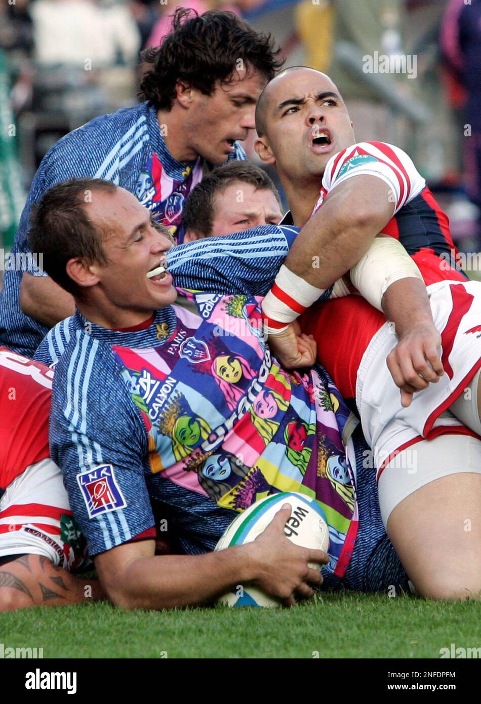 Captain Sergio Parisse of Stade Francais, left, reacts after scoring a ...