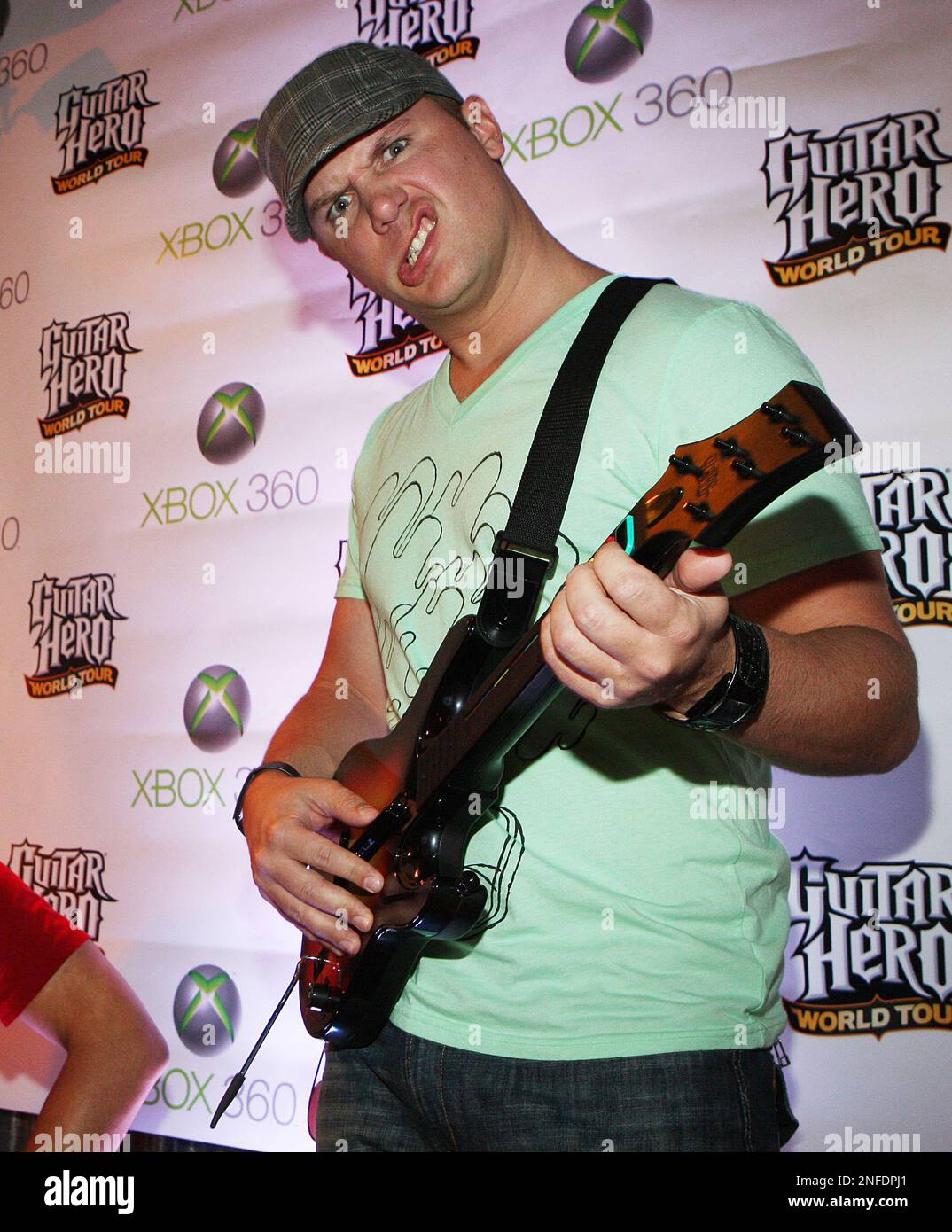 Heath Burgett rocks out on the new Guitar Hero World Tour game at the ...