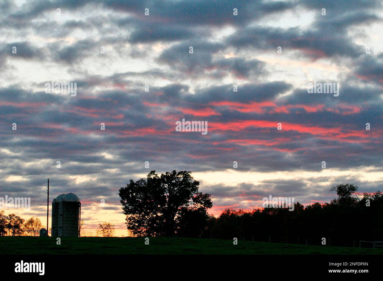 The sun sets over a farm in Bellefonte, Pa., Friday, Oct. 17, 2008.(AP ...