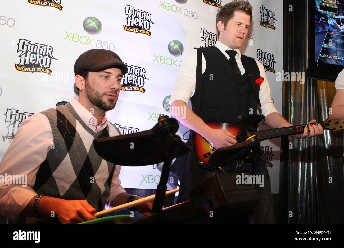 Sean Gerrity and Josh Huslig rock out on the new Guitar Hero World Tour ...