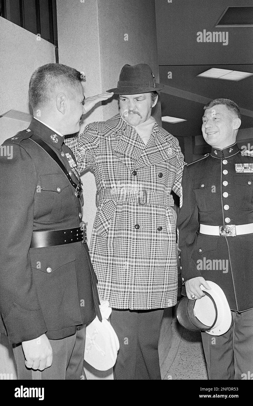 Former Marine Chuck Wepner salutes Marine Maj. Ray Findlay, left after ...