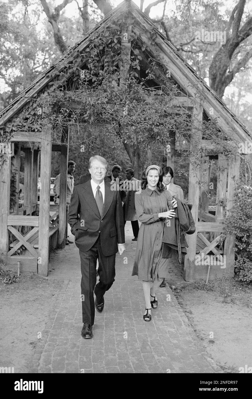 Accompanied by his daughter-in-law, Caron Carter, right, President ...
