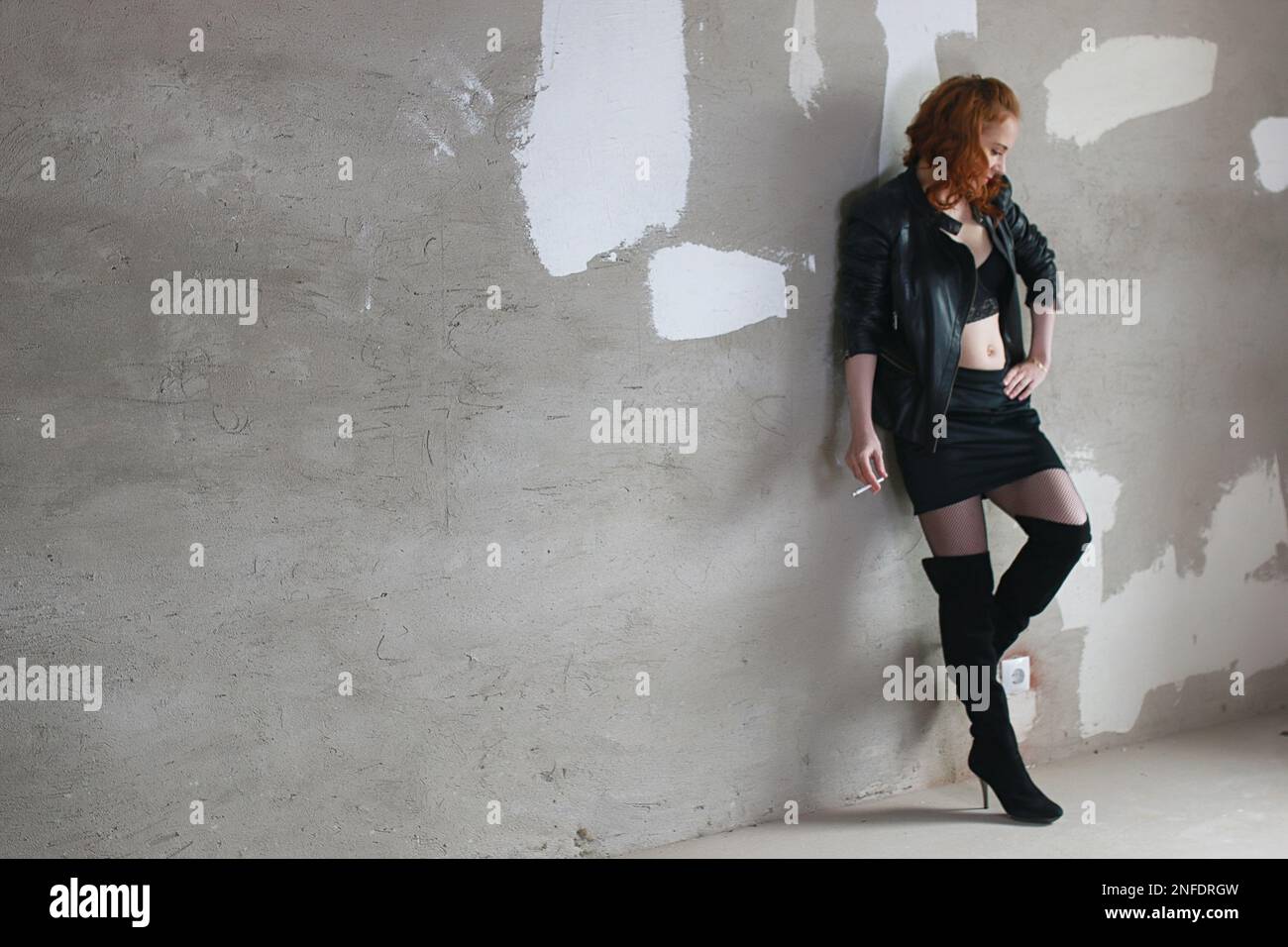 Girl addict in a leather jacket with a dose in a syringe prostitute ...