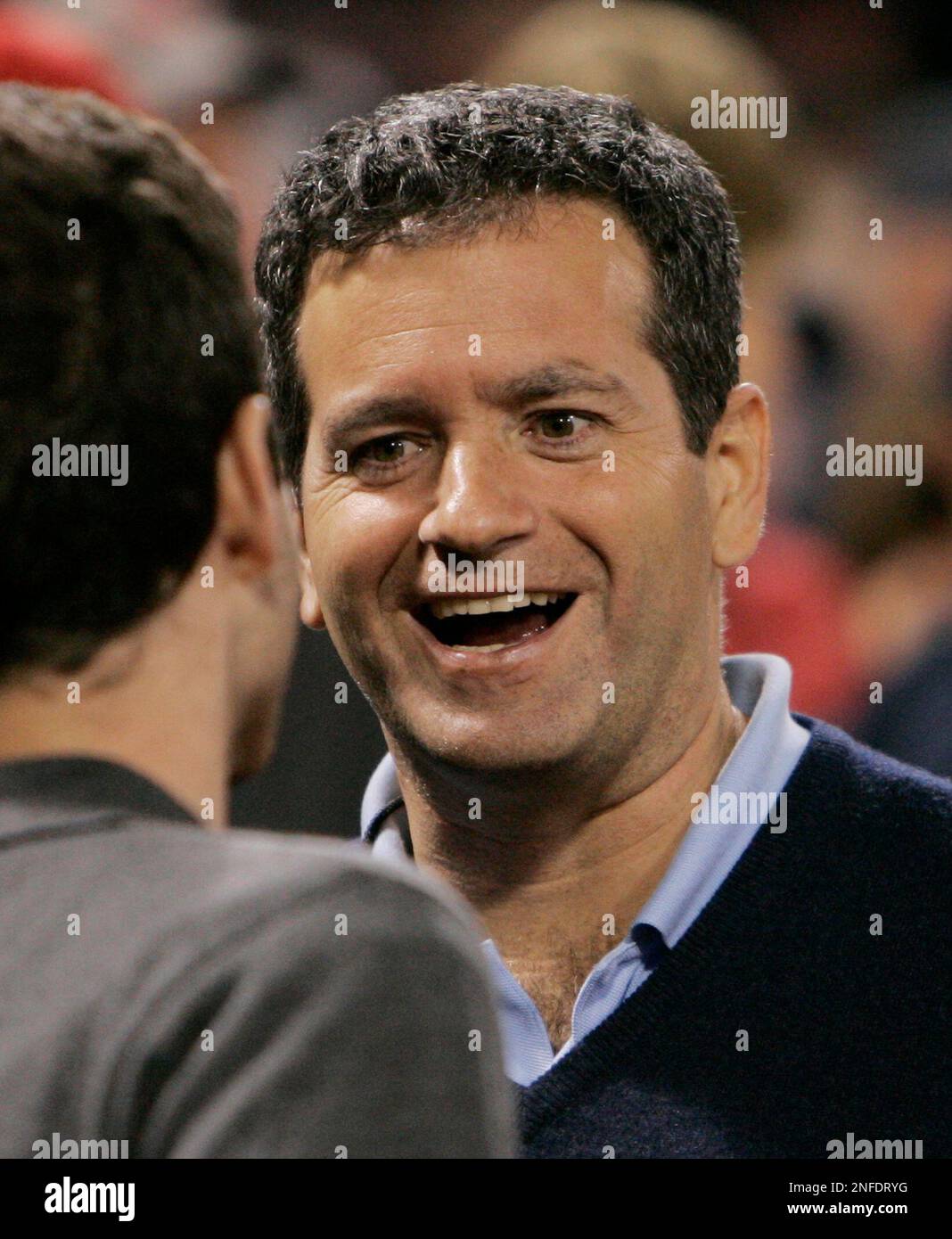 Tampa Bay Rays' owner Stuart Sternberg speaks to an unidentified person ...