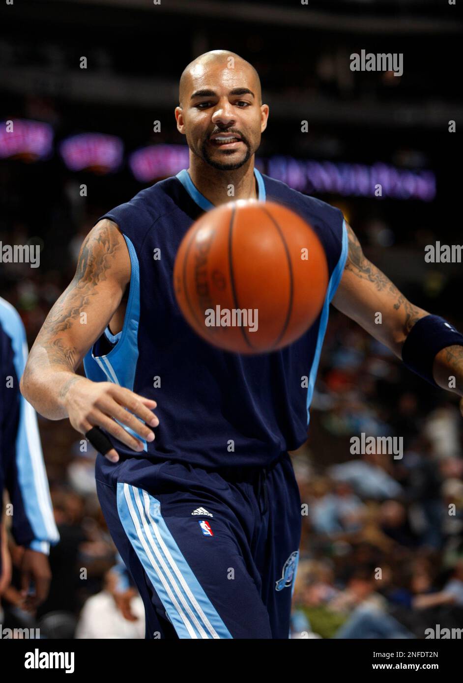 Utah Jazz forward Carlos Boozer warms up before facing the Denver ...