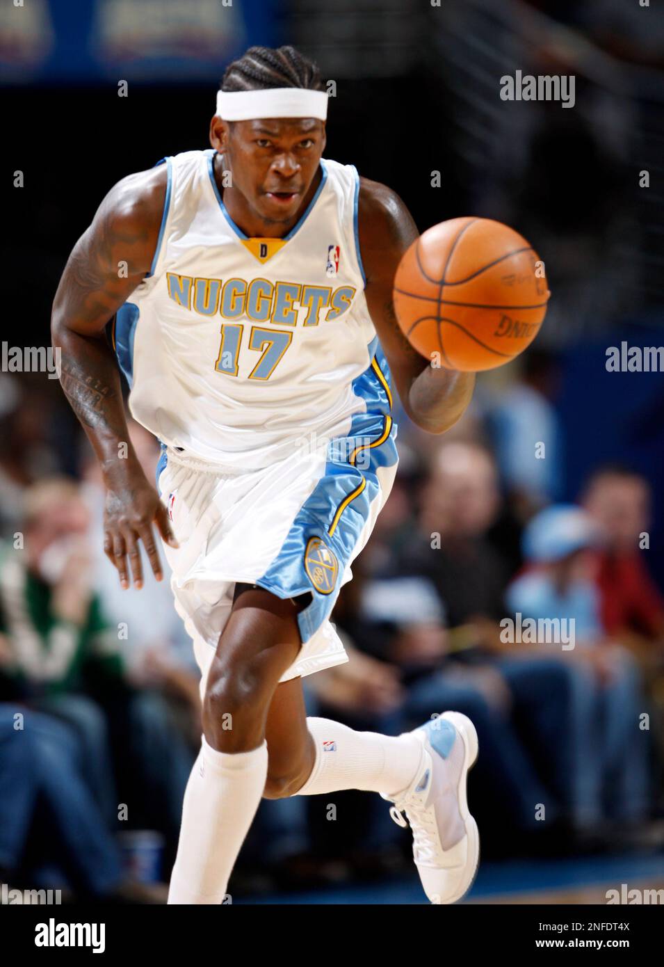 Denver Nuggets guard William "Smush" Parker picks up a loose ball ...