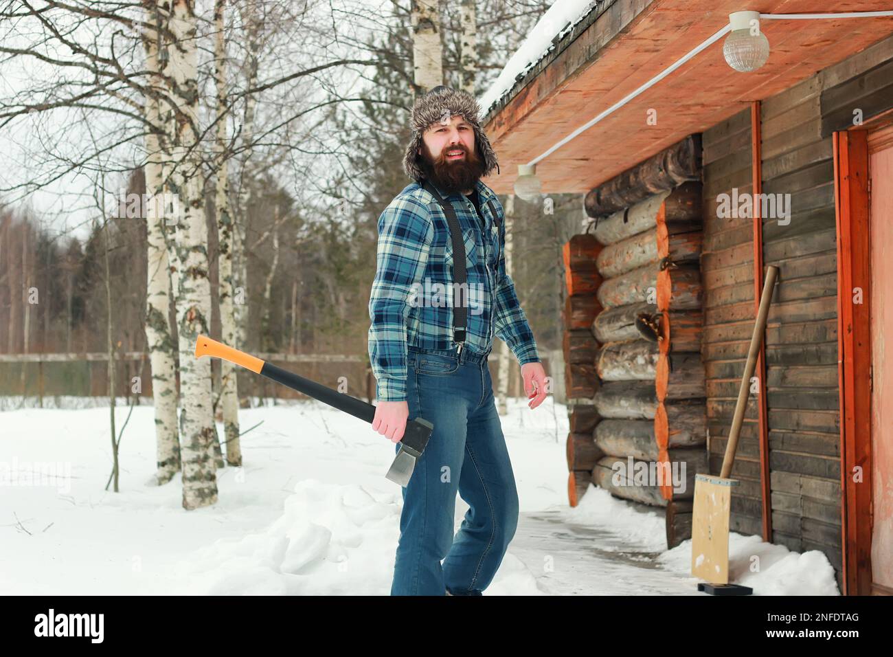 man in winter with axe Stock Photo - Alamy