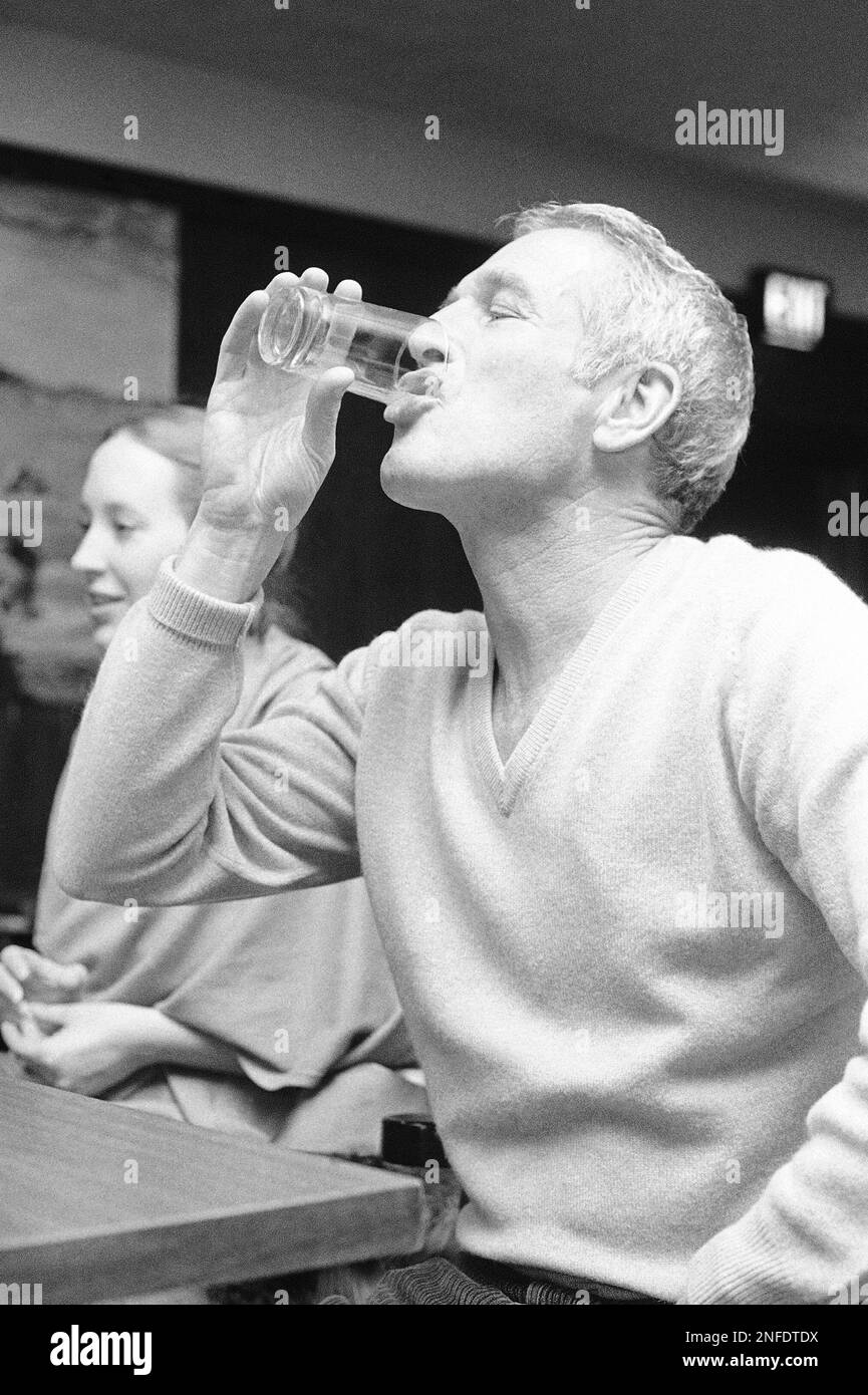 Actor Paul Newman is shown having a beer during an interview at his ...
