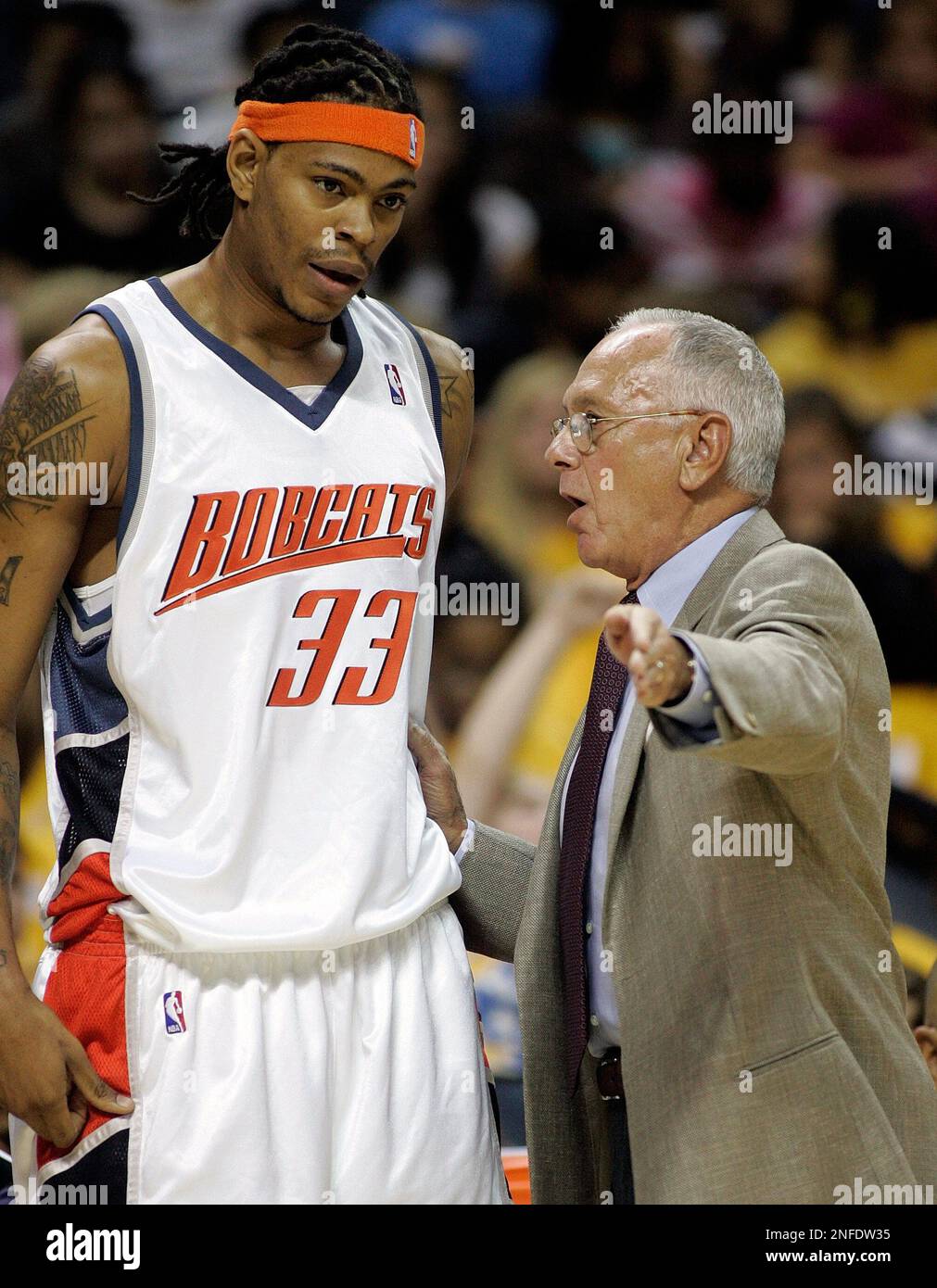 Charlotte Bobcats head coach Larry Brown, right, gives instructions to ...