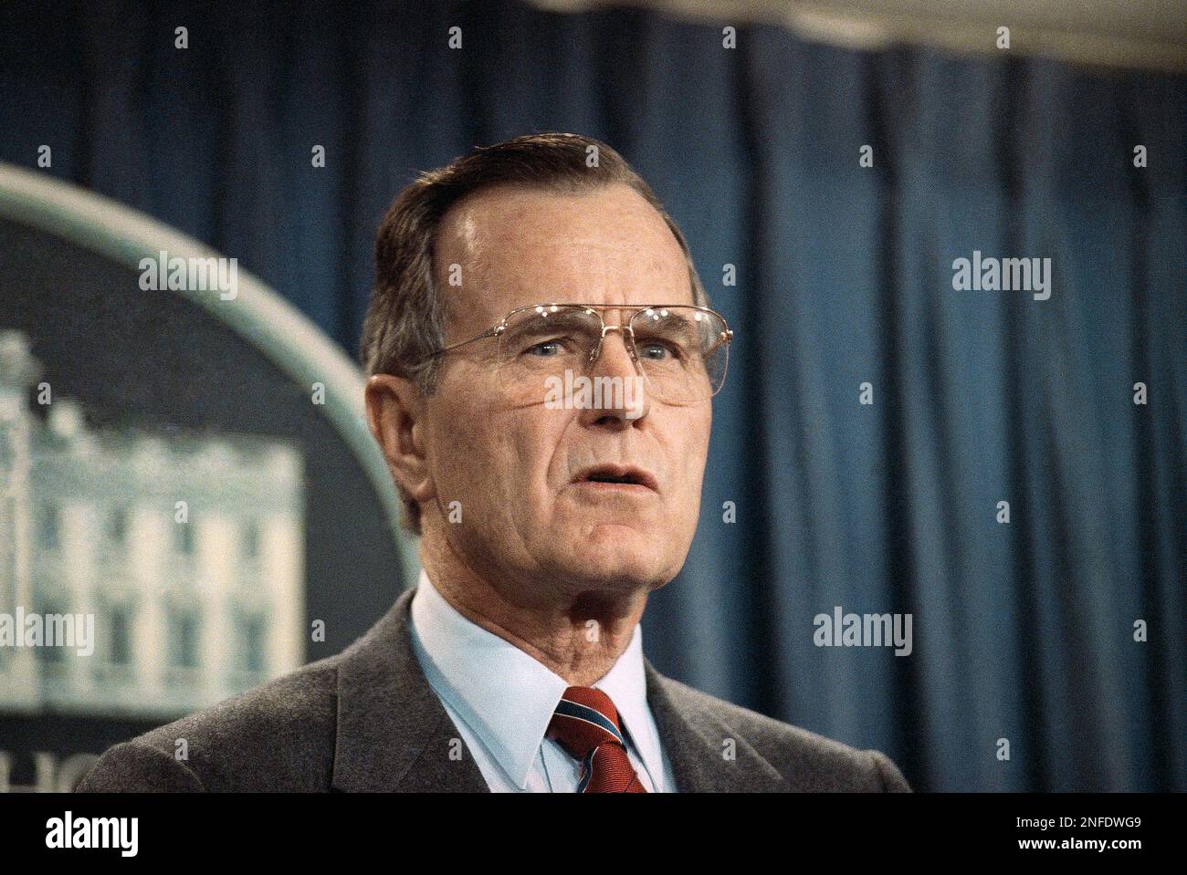 President George Bush talks to reporters in the White House Press Room ...