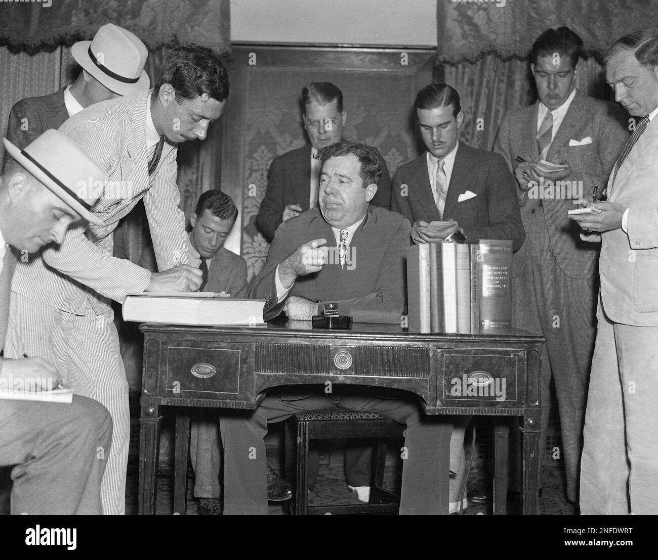 Huey P. Long, politician from Louisiana, is shown speaking to reporters ...