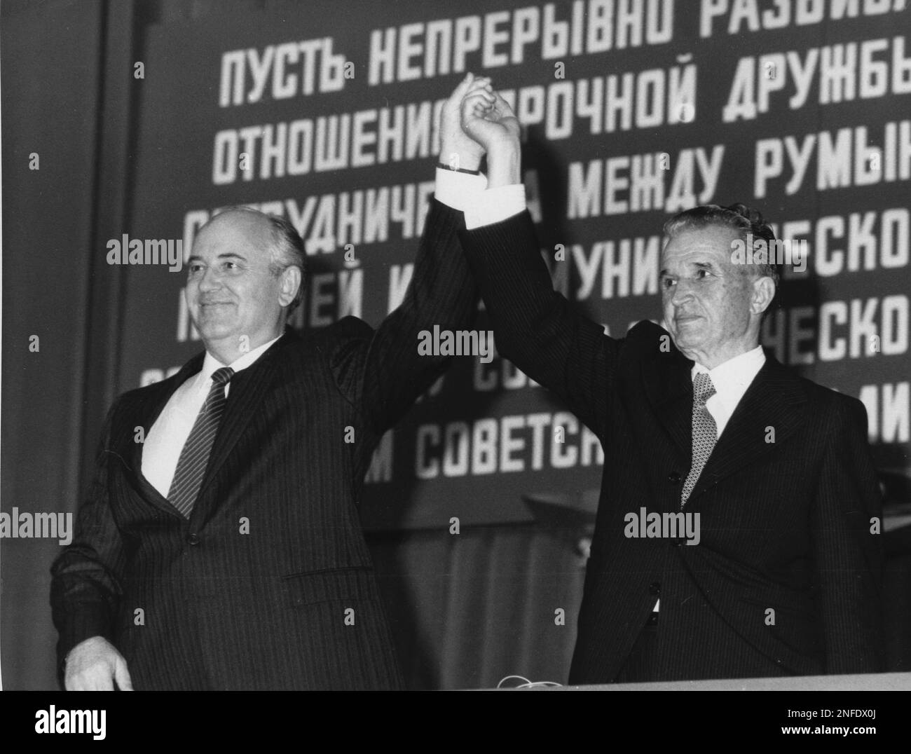 Romania's President Nicolae Ceausescu, right, holds the hand of Soviet ...