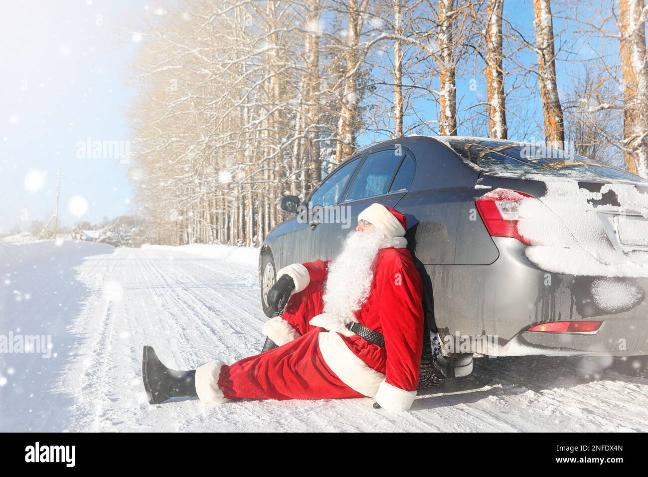 Santa Claus comes with gifts from the outside. Santa in a red suit with ...