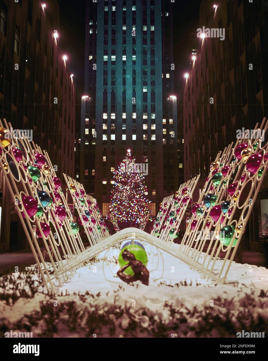 Rockefeller Center's famous Christmas tree (center background, in front ...