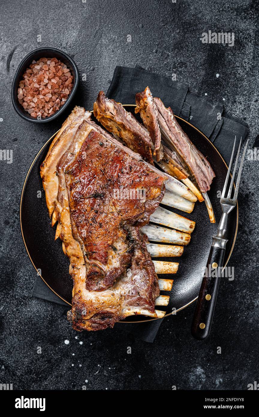 Roasted Rack of lamb ribs, mutton spareribs, sliced meat on plate ...