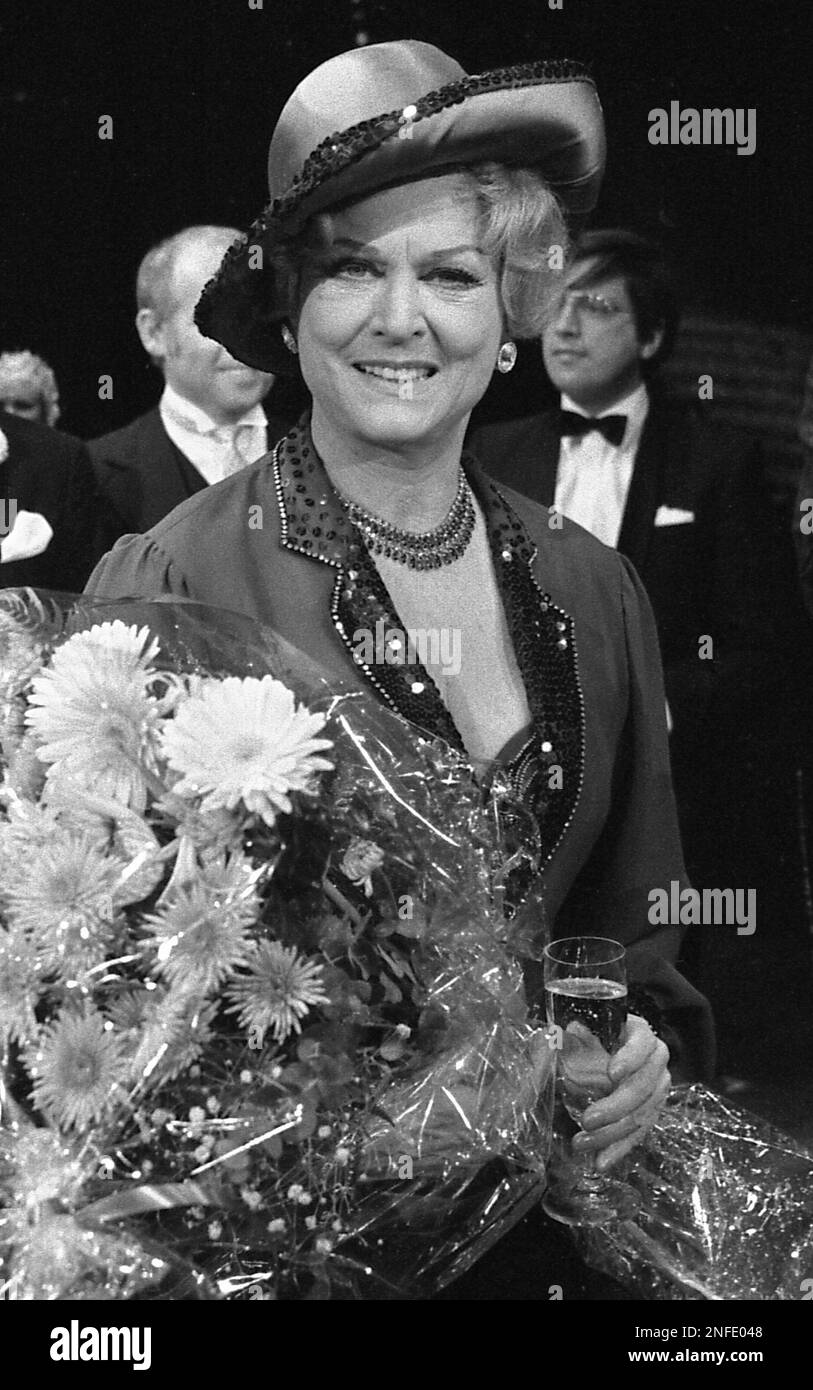 Hungarian born singer, dancer and actress Marika Roekk, left, holds a ...