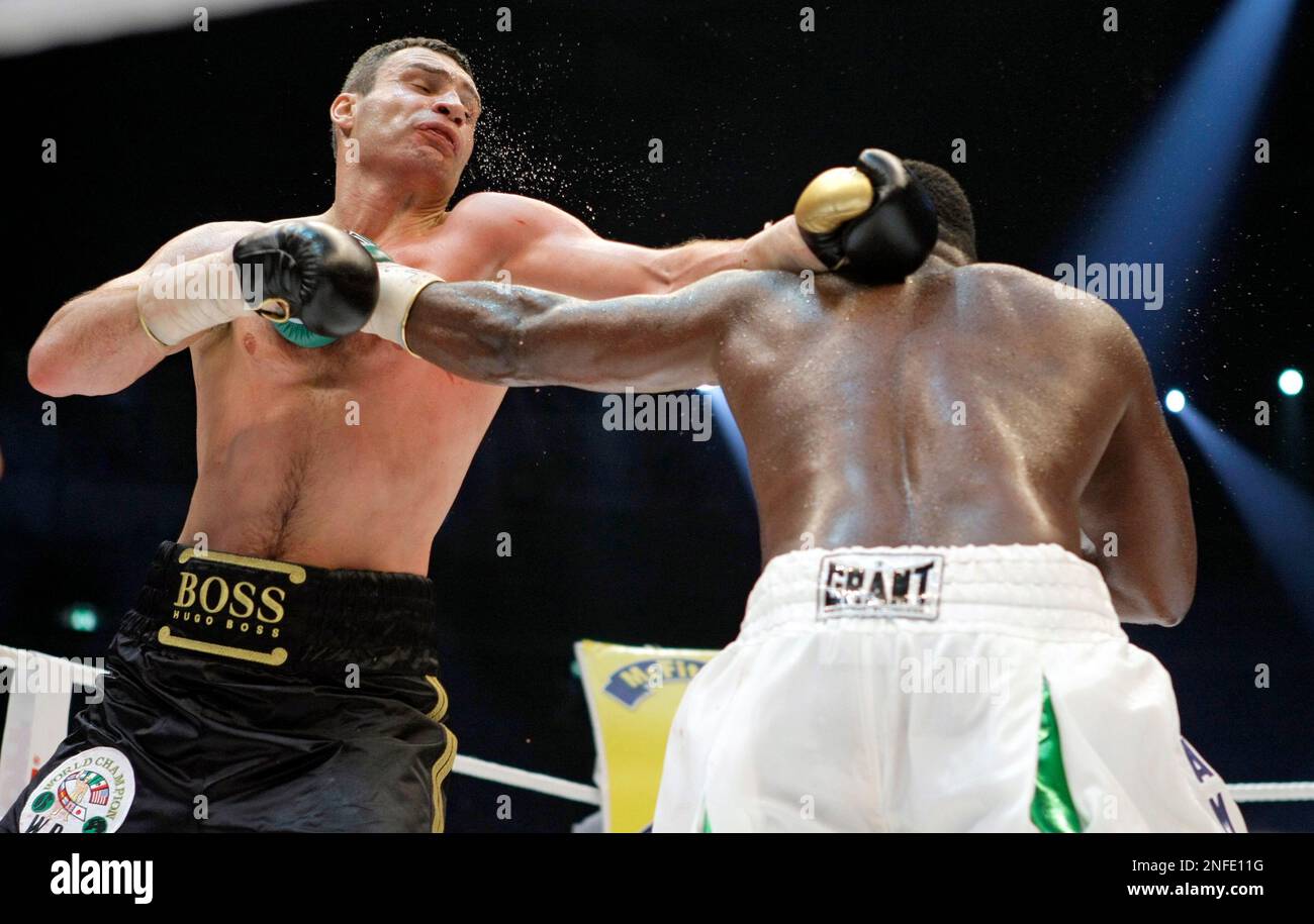 Vitali Klitschko, left, exchanges blows with Samuel Peter during a WBC ...