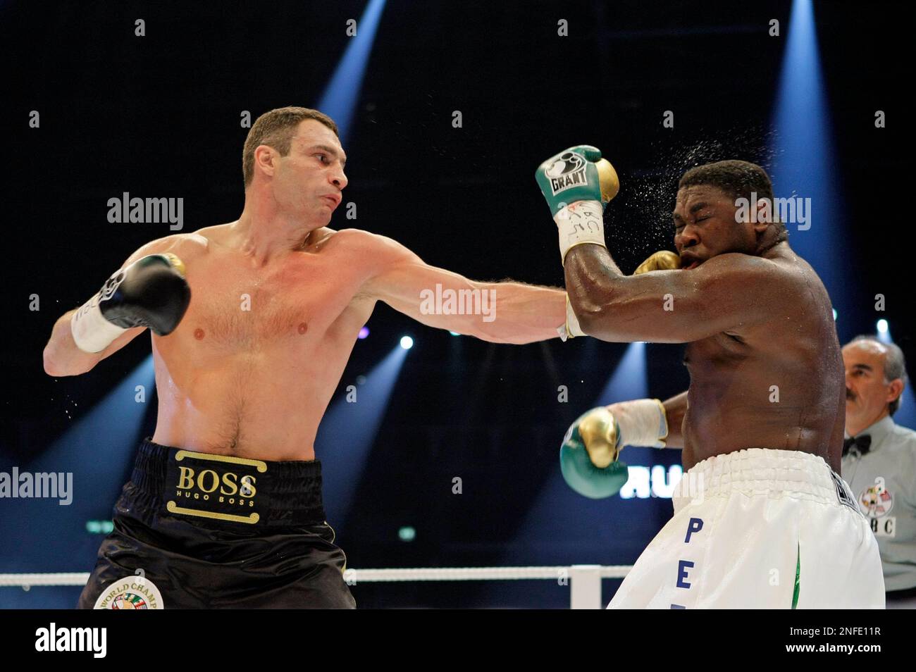 Vitali Klitschko, left, hits Samuel Peter during a WBC heavyweight ...