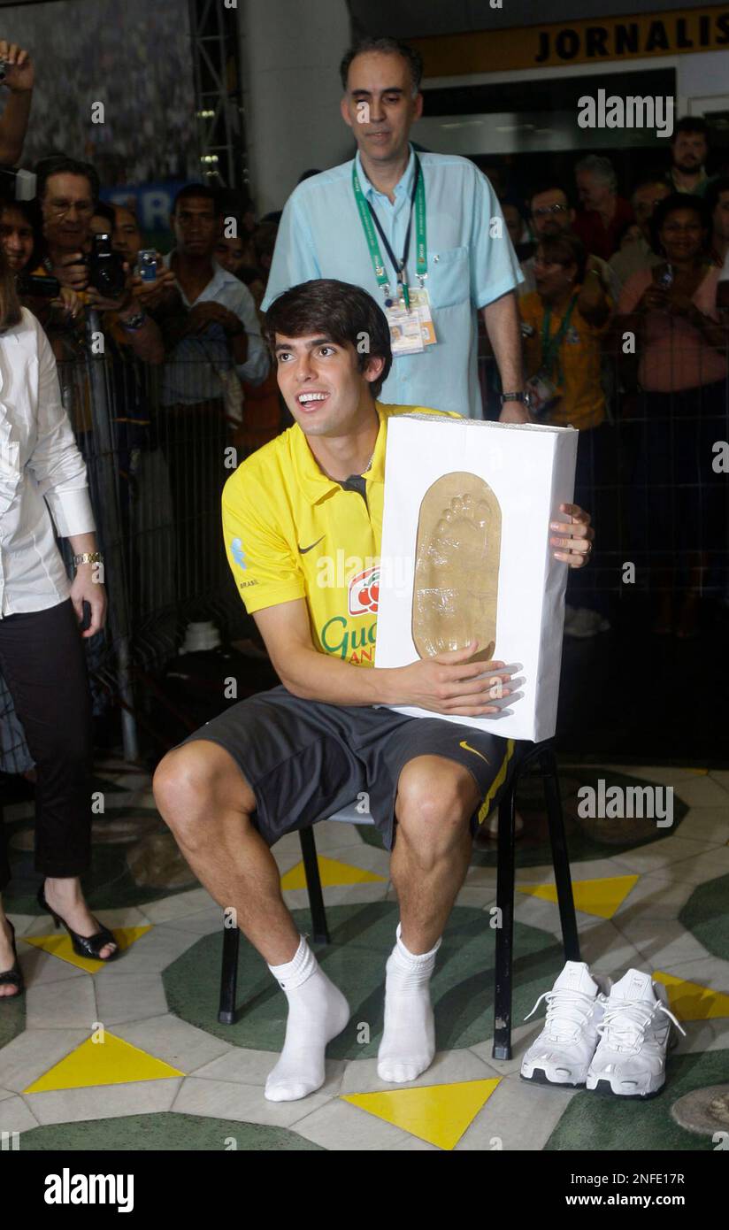 Brazil's soccer player Kaka holds his footprint made for Maracana's ...
