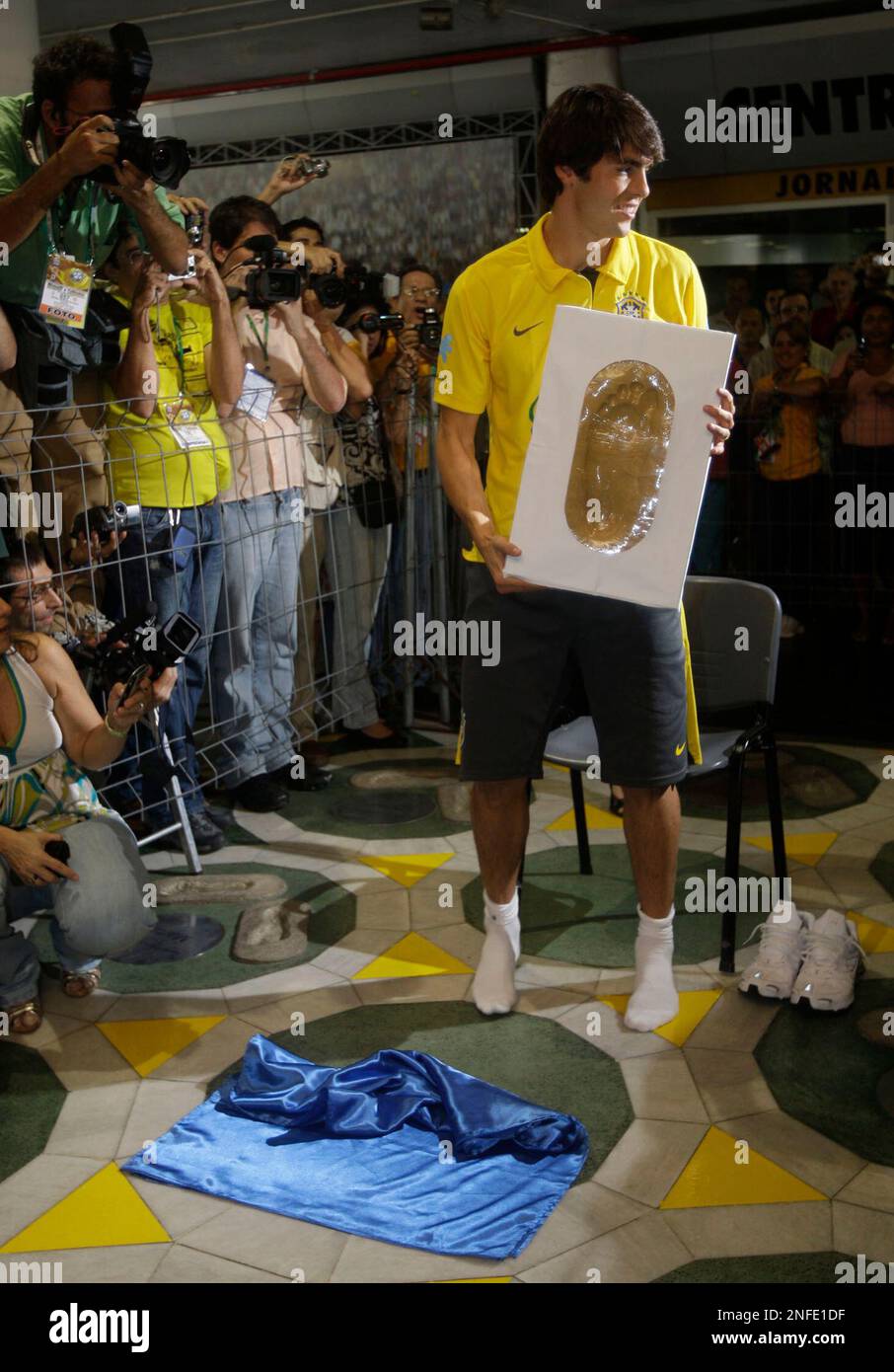 Brazil's soccer player Kaka holds his footprint made for Maracana's ...