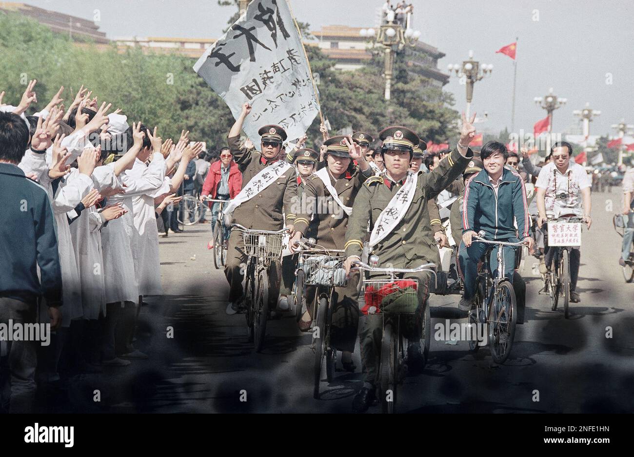 Beijing police parade through Tiananmen Square carrying banners in ...