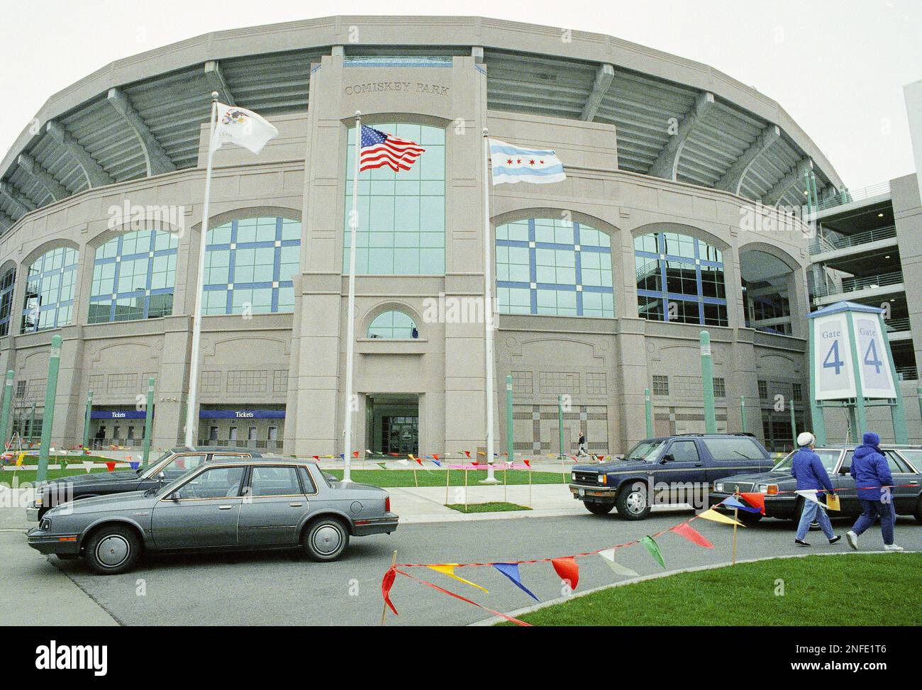 Visitors walk by the exterior of the new Comiskey Park, April 14 ...