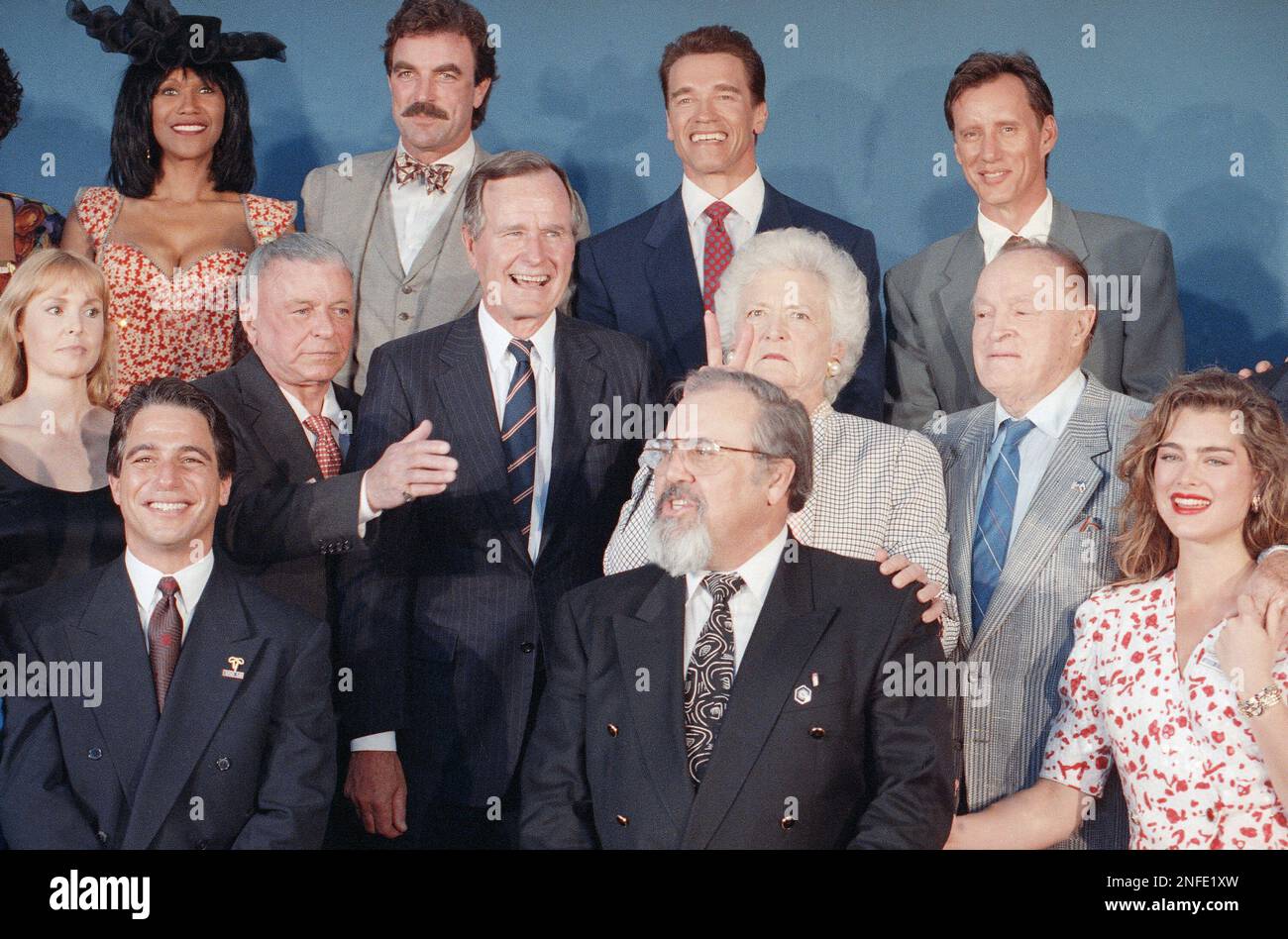 Mrs. Barbara Bush, middle row, second from right, places two of her ...