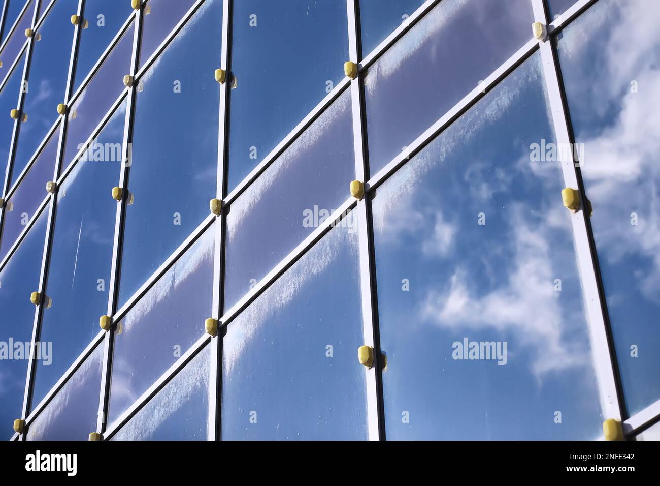 Architectural detail of the facade with multiple reflections of other ...