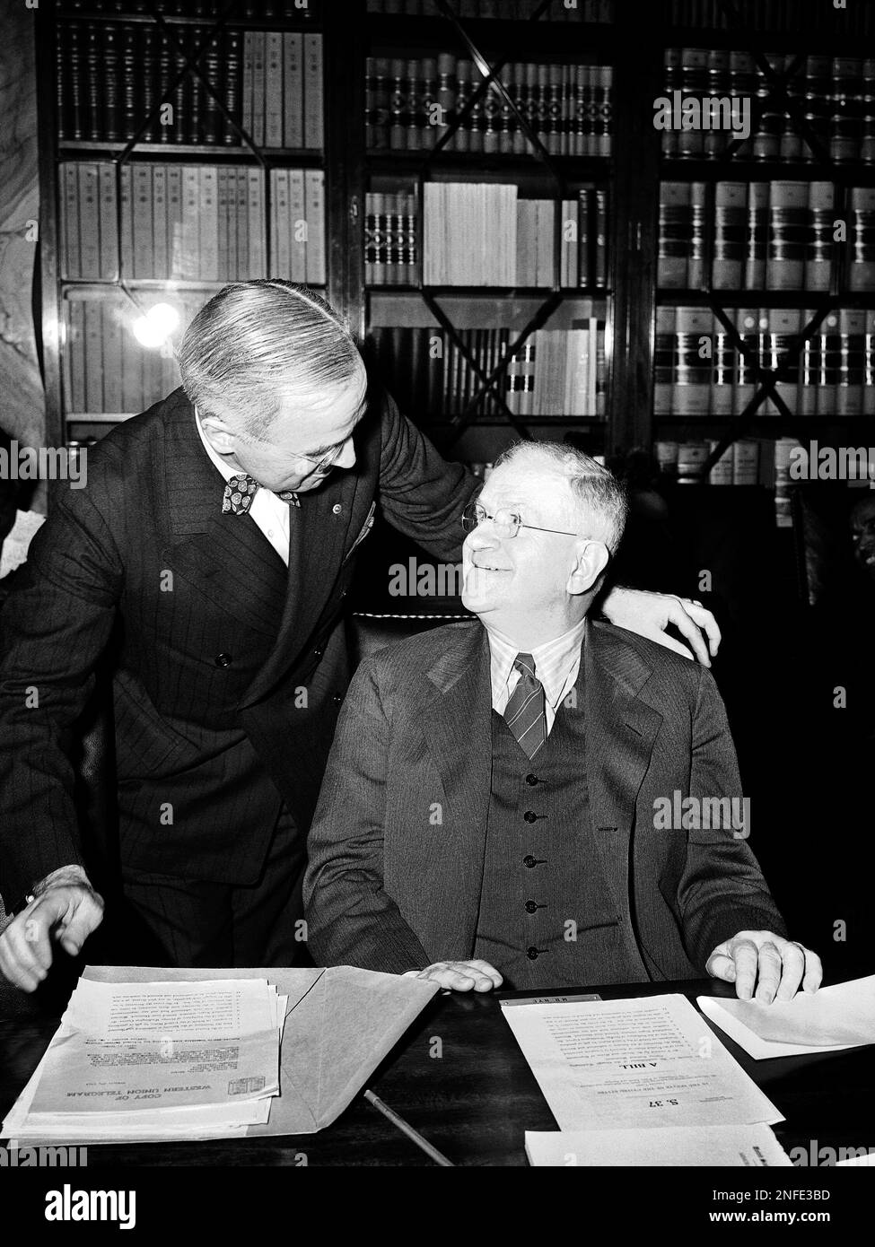 Sen. Harry Truman, left, and Secretary of Interior Harold Ickes, sign ...
