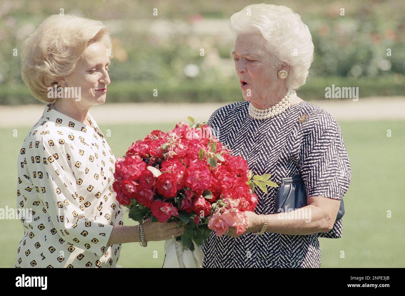 First Lady Barbara Bush is presented a bouquet of Barbara Bush roses ...