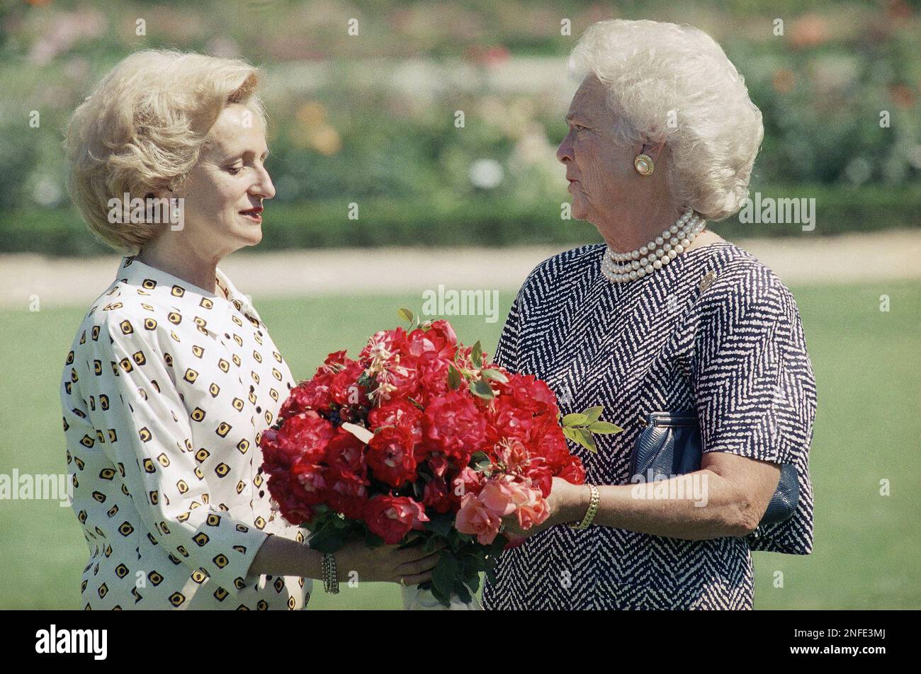 First Lady Barbara Bush is presented a bouquet of Barbara Bush roses ...