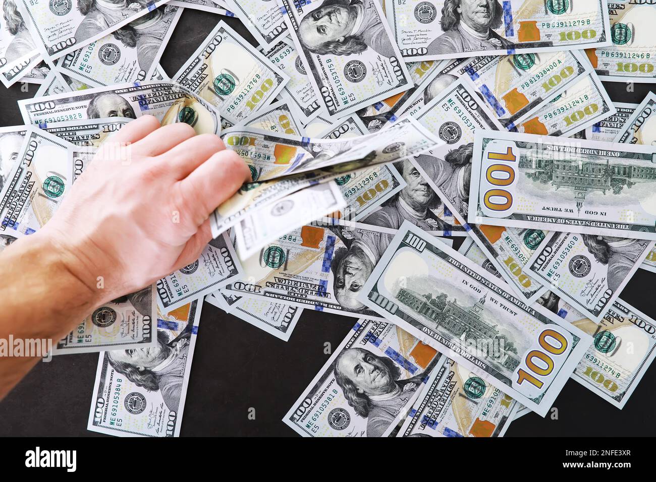 Cash money in a large pile as a finance background. Paper money close ...