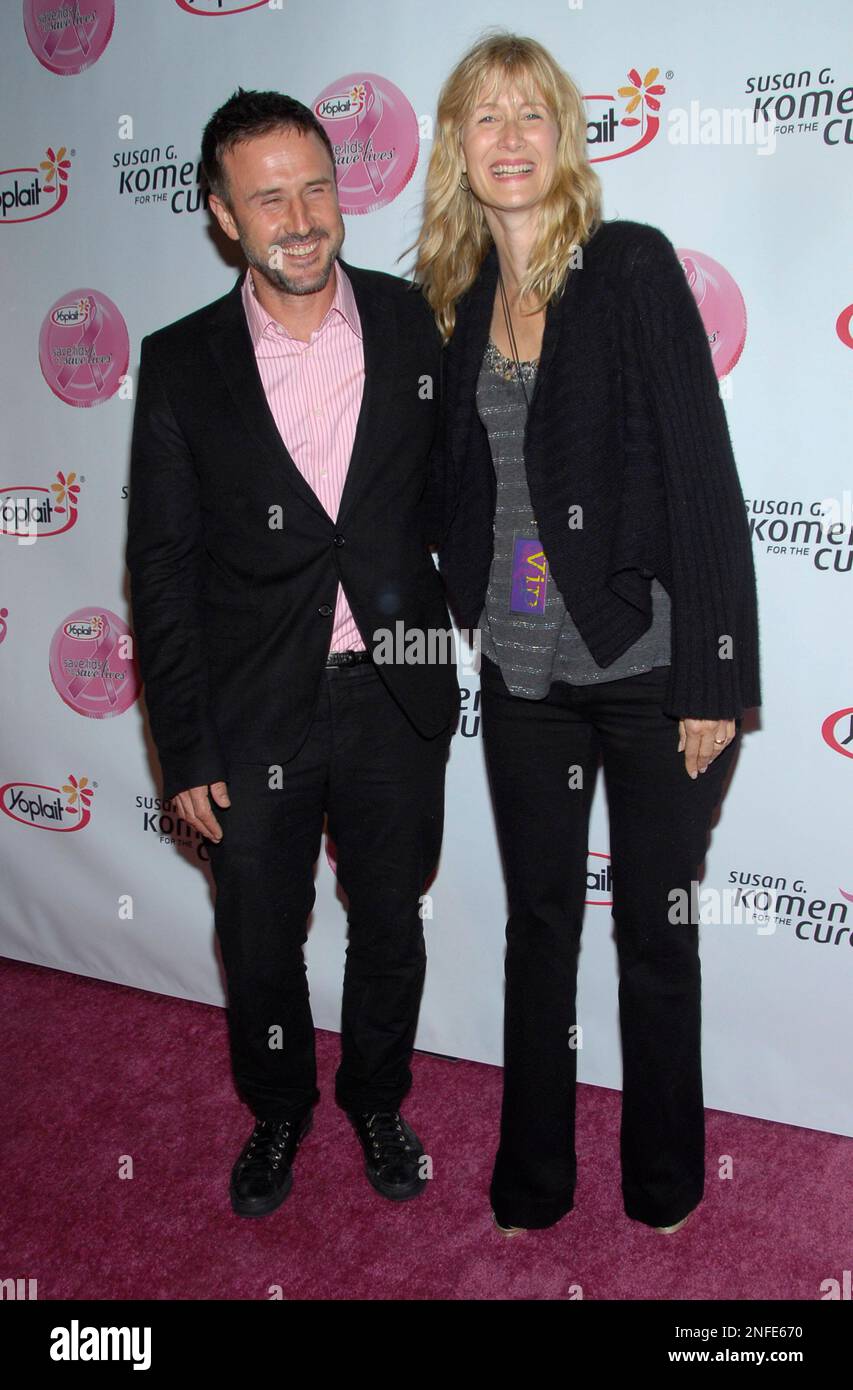 Actress Laura Dern, right, and actor David Arquette pose on the press ...