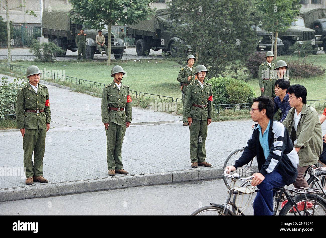 Soldiers from the Peoples Liberation Army (PLA) stand at attention on ...