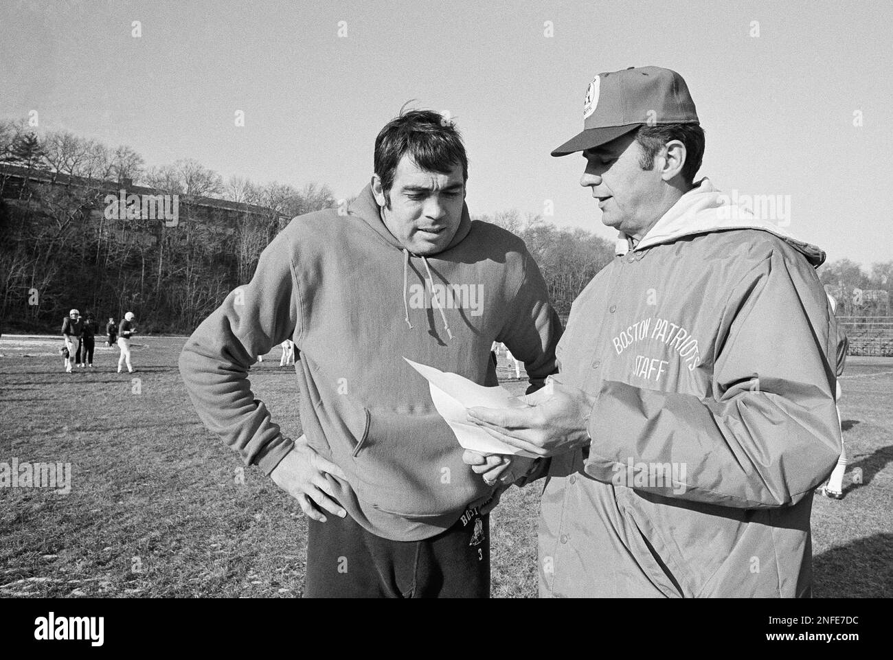 Boston Patriots quarterback Joe Kapp, left, confers with head coach ...