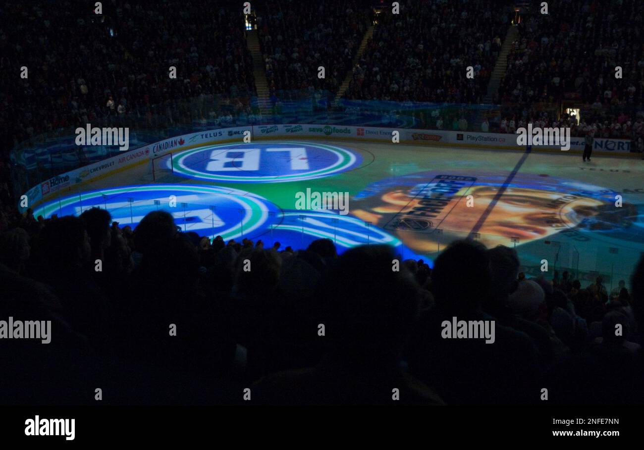Vancouver Canucks defenceman Luc Bourdon's picture is projected on the ...