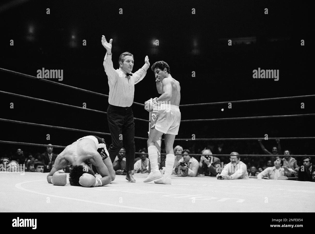 Undefeated Wilfredo Gomez, right, is separated by the referee after ...