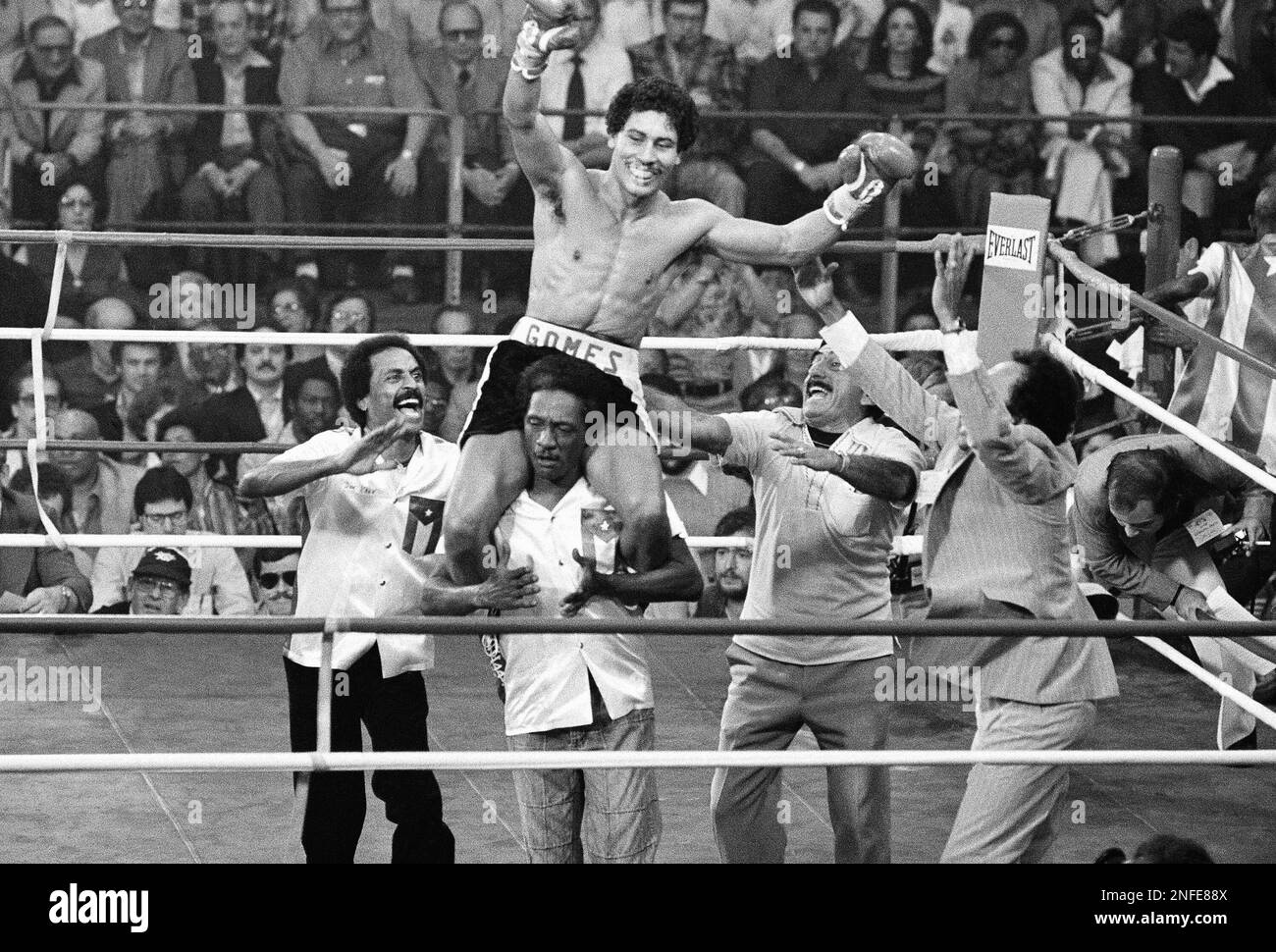 WBC Super Bantamweight champion Wilfredo Gomez of Puerto Rico is held ...