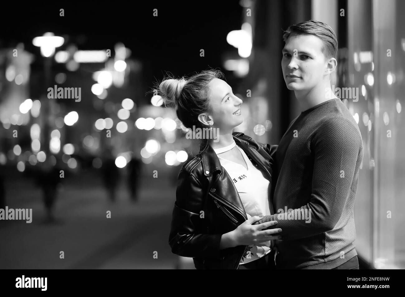 Beautiful couple on a date in a night city outdoor Stock Photo - Alamy