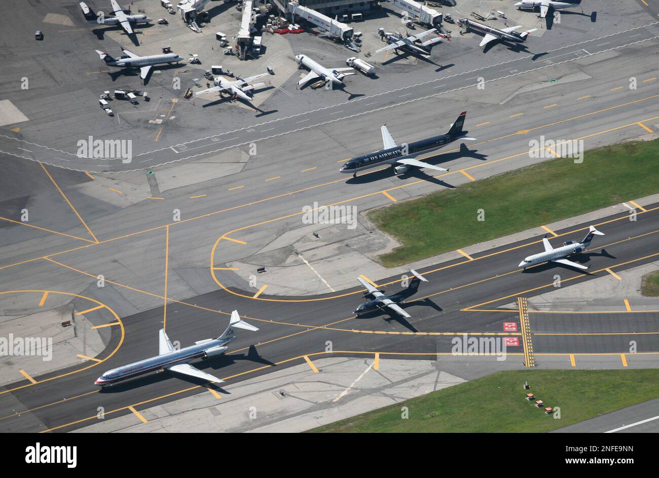 Planes taxi on runways at LaGuardia Airport, Monday, Sept. 8, 2008 in ...