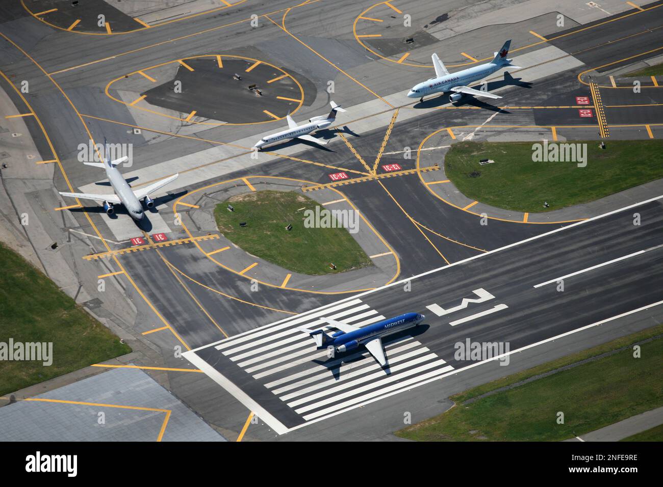 Planes taxi on runways at LaGuardia Airport, Monday, Sept. 8, 2008 in ...