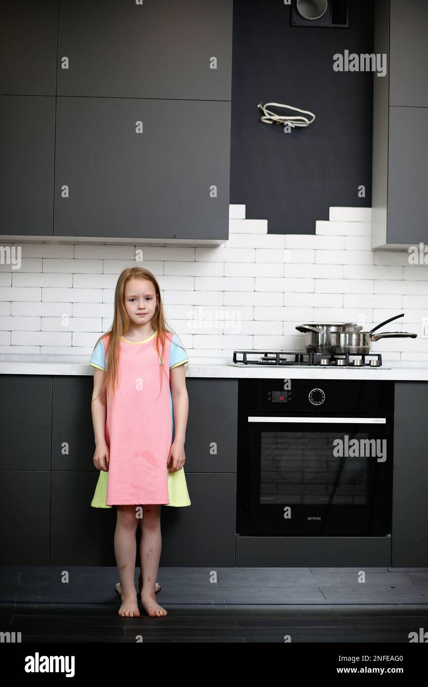 little girl in the kitchen posing at the camera Stock Photo - Alamy