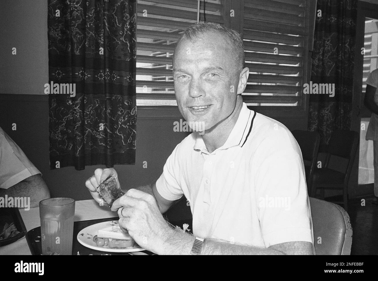 Col John Glenn eats lunch at Grand Turk Island on Feb. 20, 1962 after ...