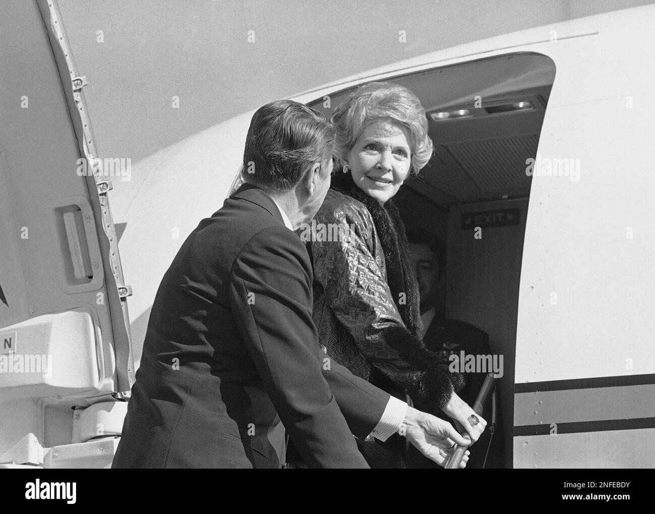 President-elect Ronald Reagan and his wife Nancy, wave good-bye as they ...