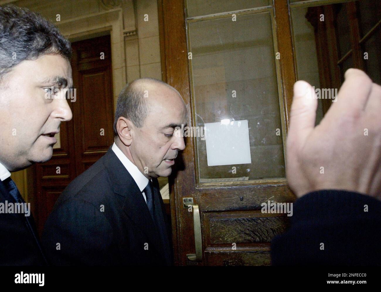 Pierre-Joseph Falcone, center, arrives at a Paris courthouse, Tuesday ...