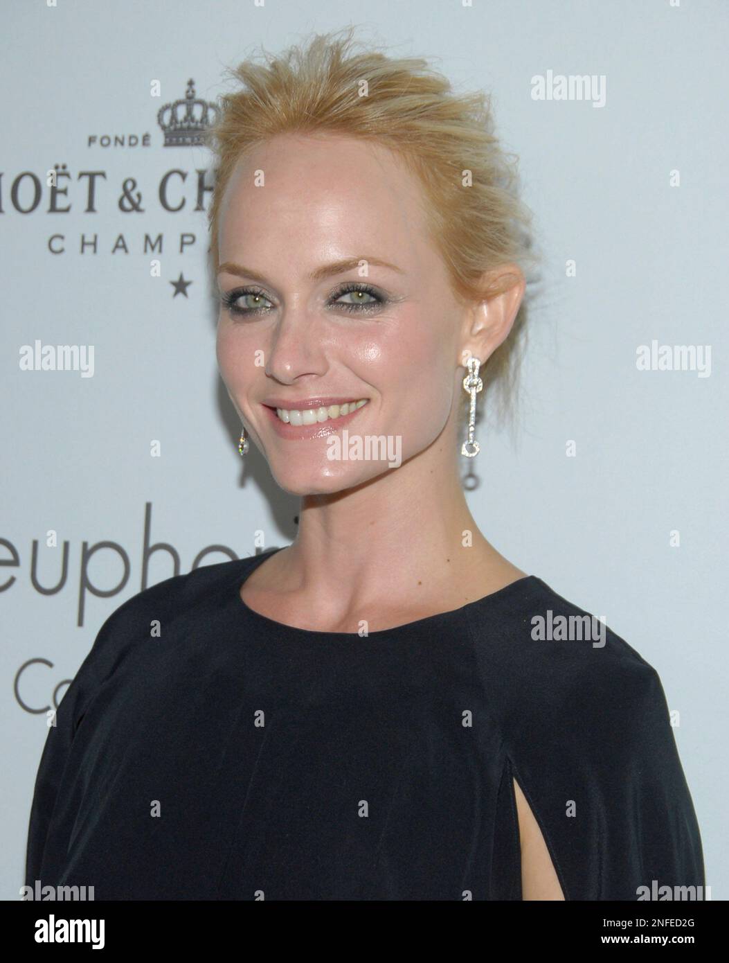 Actress and model Amber Valletta poses on the press line at Elle ...