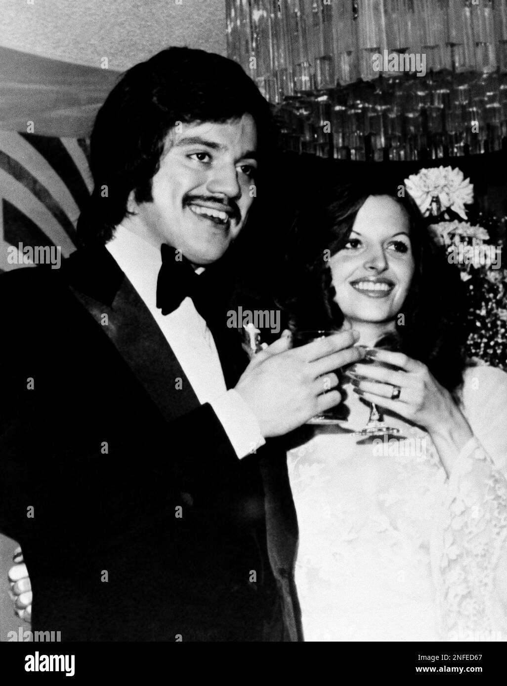 Actor Freddie Prinze is shown toasting his bride, Katherine, on their ...