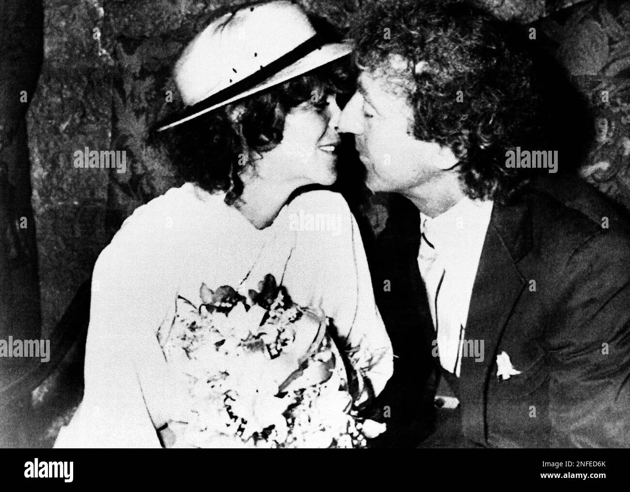 Comedian Gene Wilder kisses his wife, American actress Gilda Radner ...
